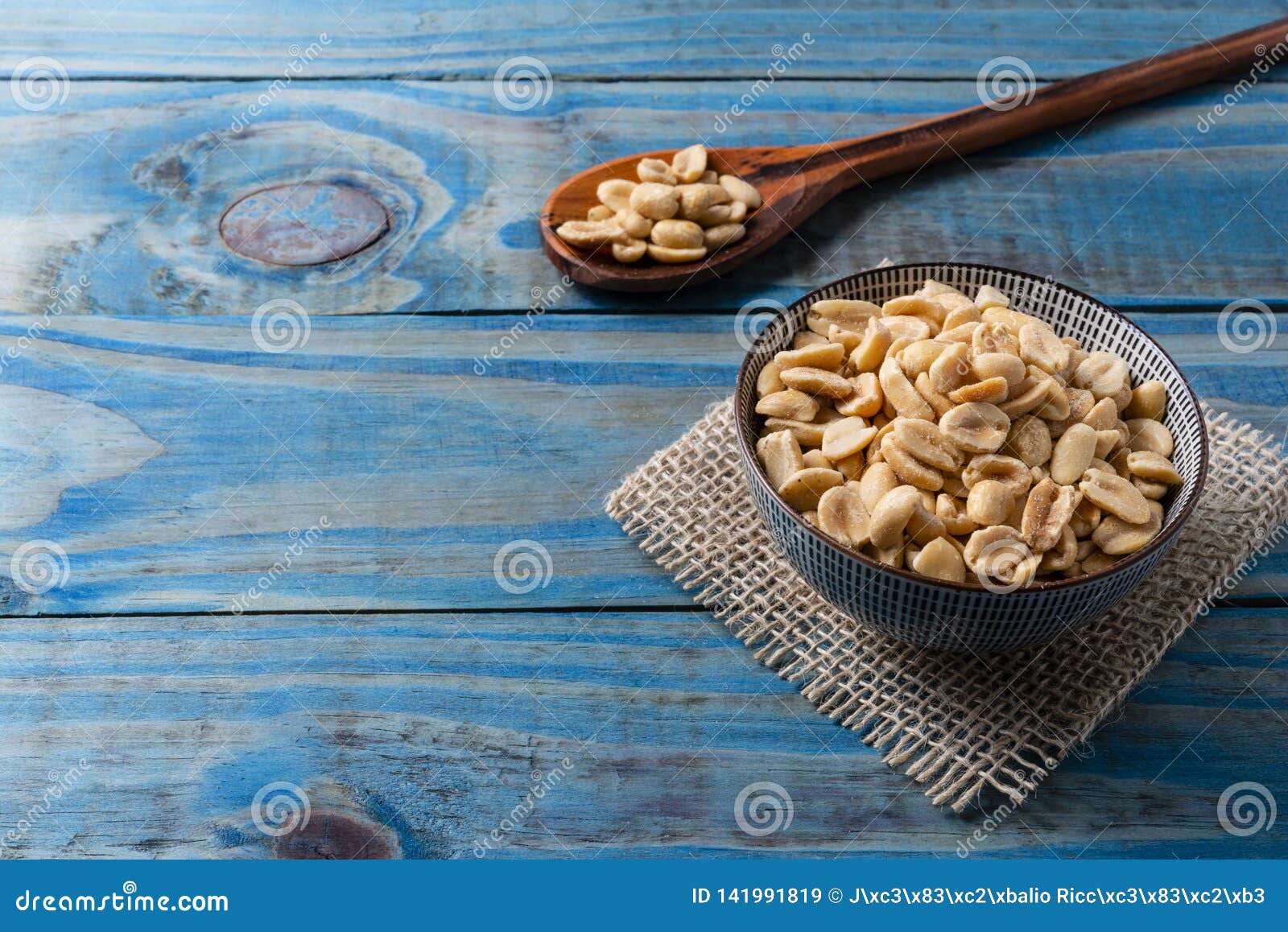 Peanut Inside Ceramic Pot Over Blue Pine Wood Stock Image - Image of ...
