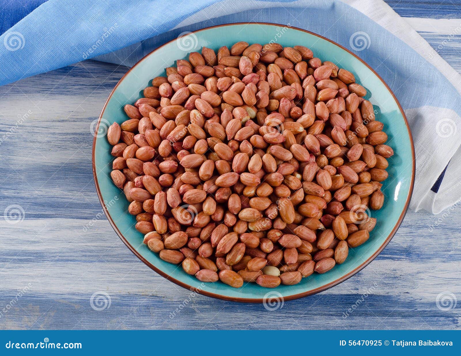 Peanuts on blue plate . stock image. Image of white, table - 56470925