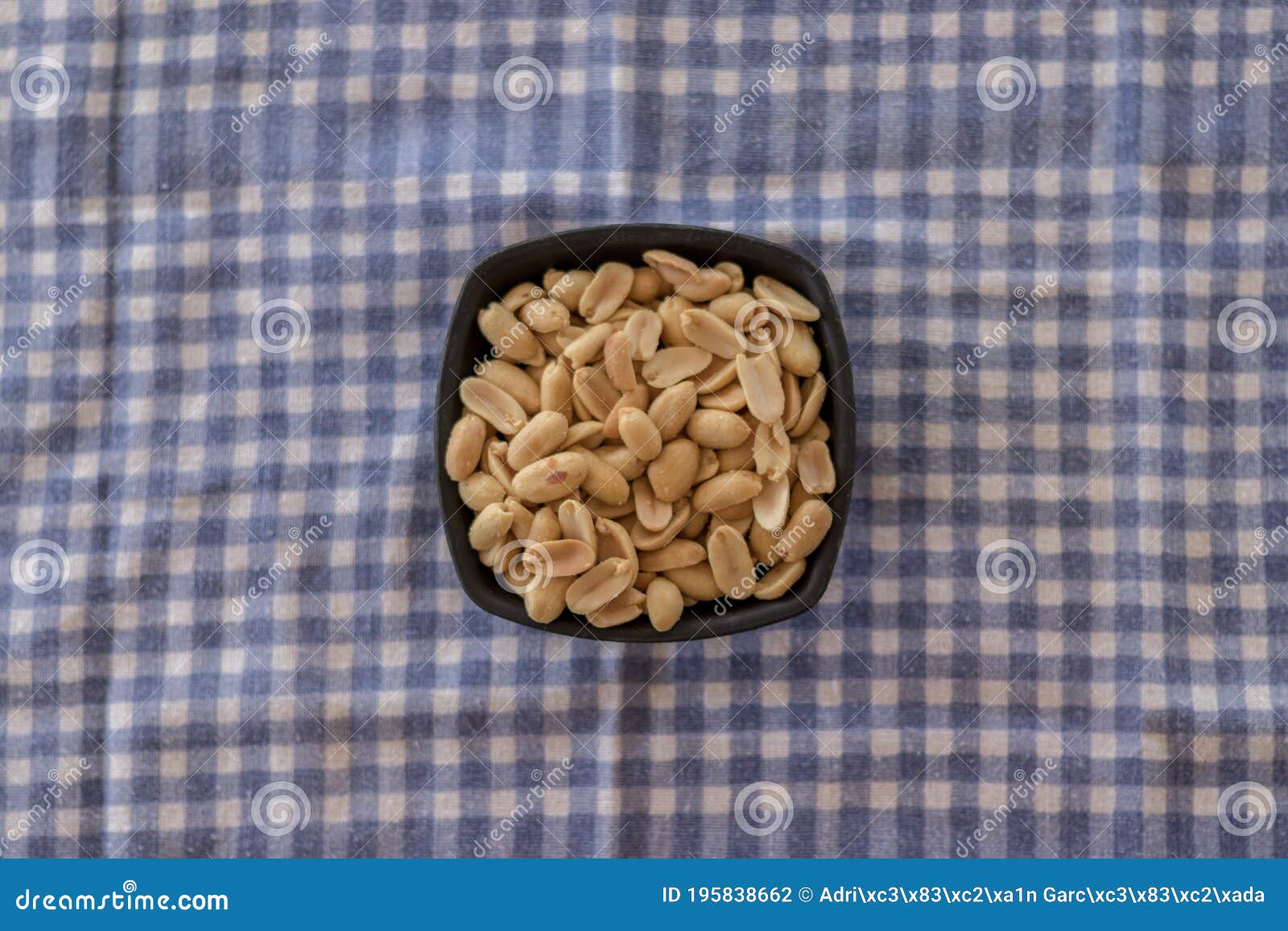 Peanuts in a container stock photo. Image of peeled - 195838662