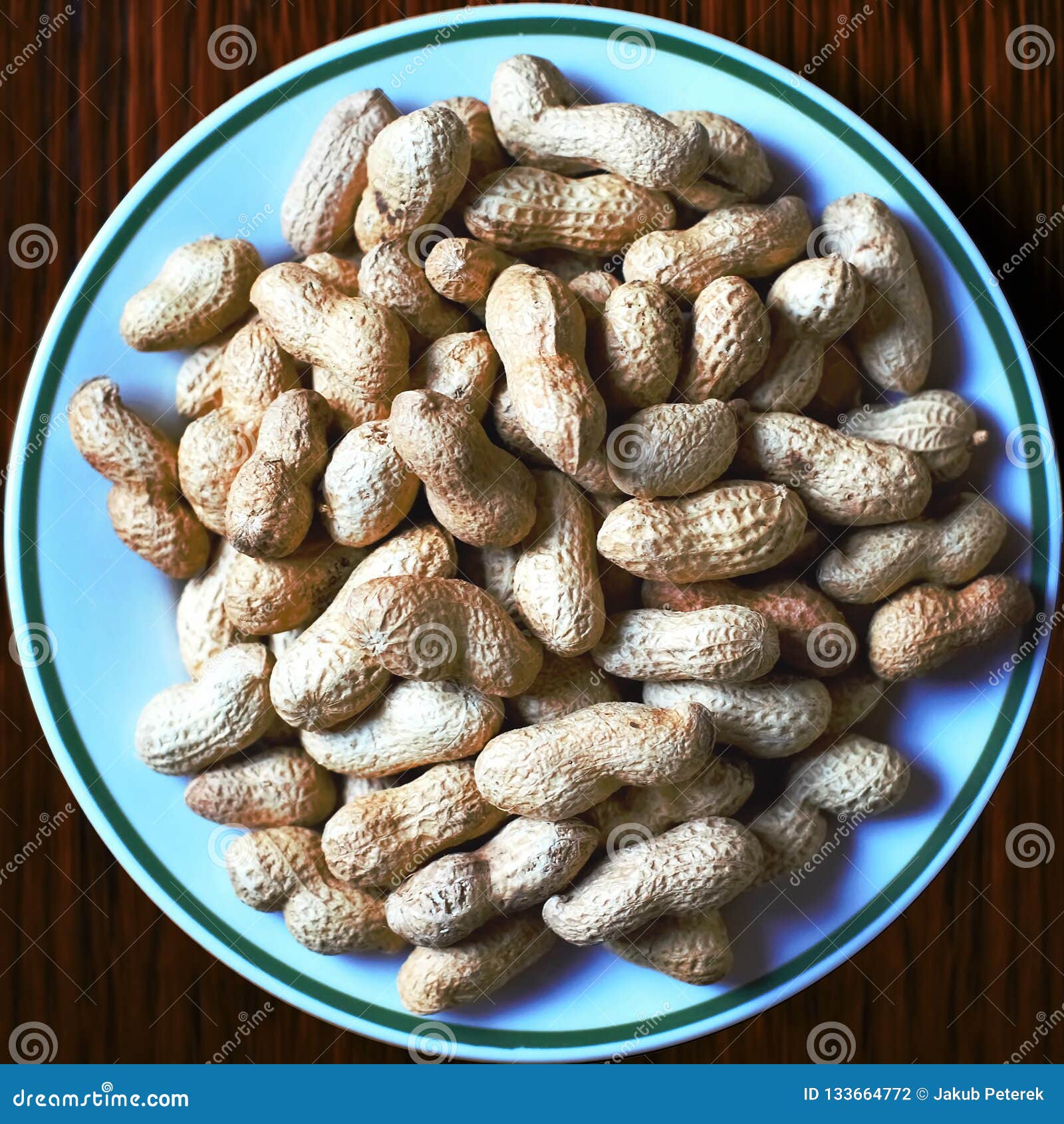 Peanuts on a plate stock photo. Image of food, nuts - 133664772