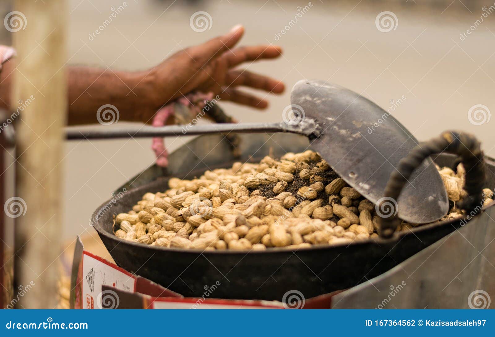 Peanuts are Roasting Using Dry Sand on a Big Pan with a Big Spoon in ...