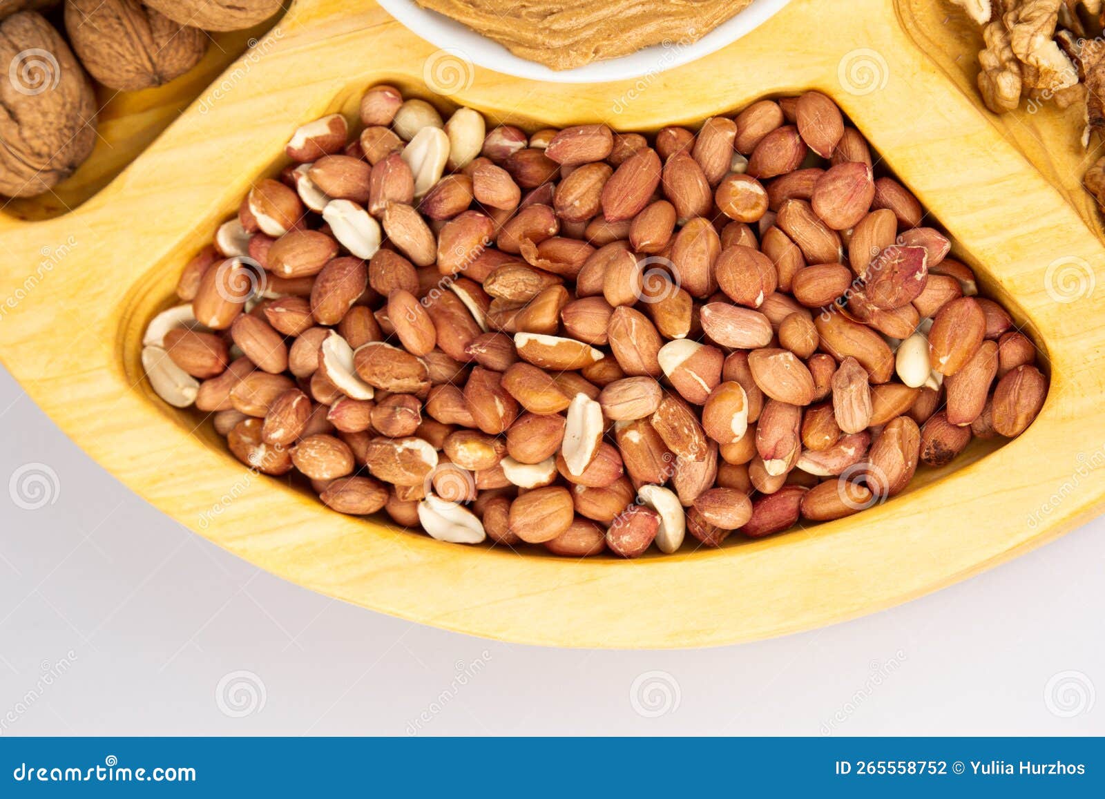 Peanuts, Walnuts and Hazelnuts in a Wooden Box with Compartments. Three ...