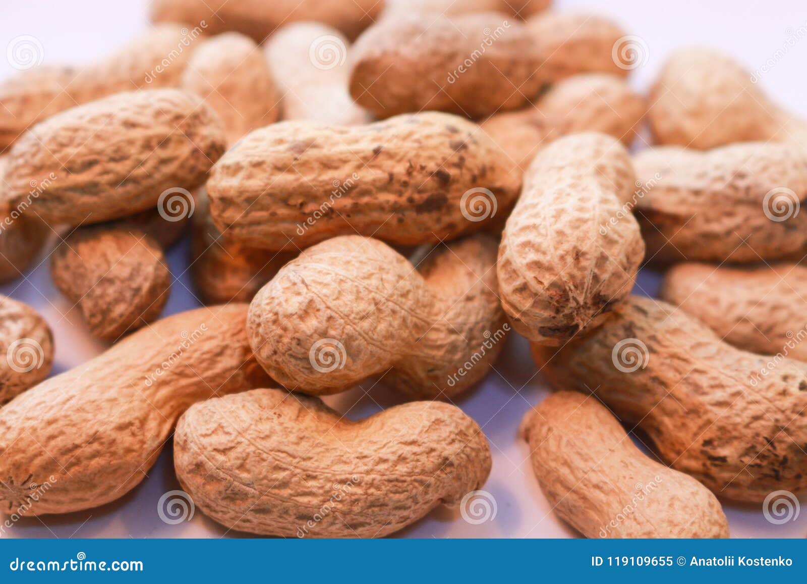 Peanuts on white surface stock image. Image of bright - 119109655
