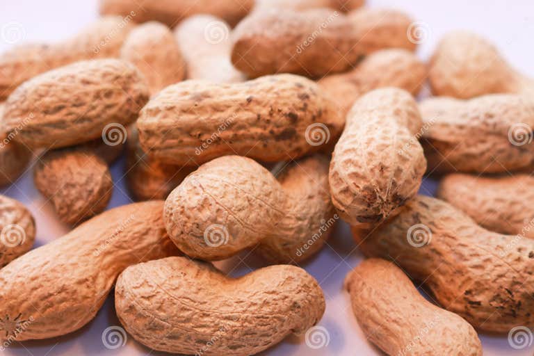 Peanuts on white surface stock image. Image of bright - 119109655