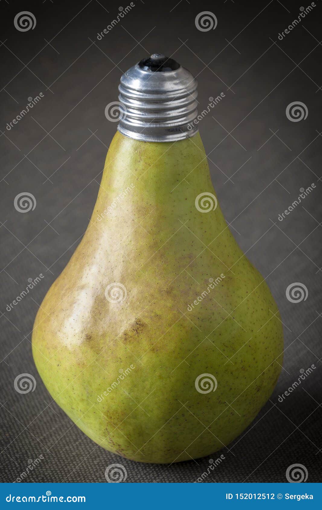 A Pear with a Base from a Light Bulb. a Creative Photo.Pear-light ...