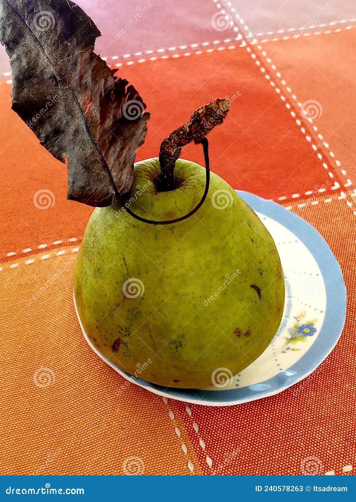 Pear on small plate stock image. Image of leaf, tablecloth - 240578263