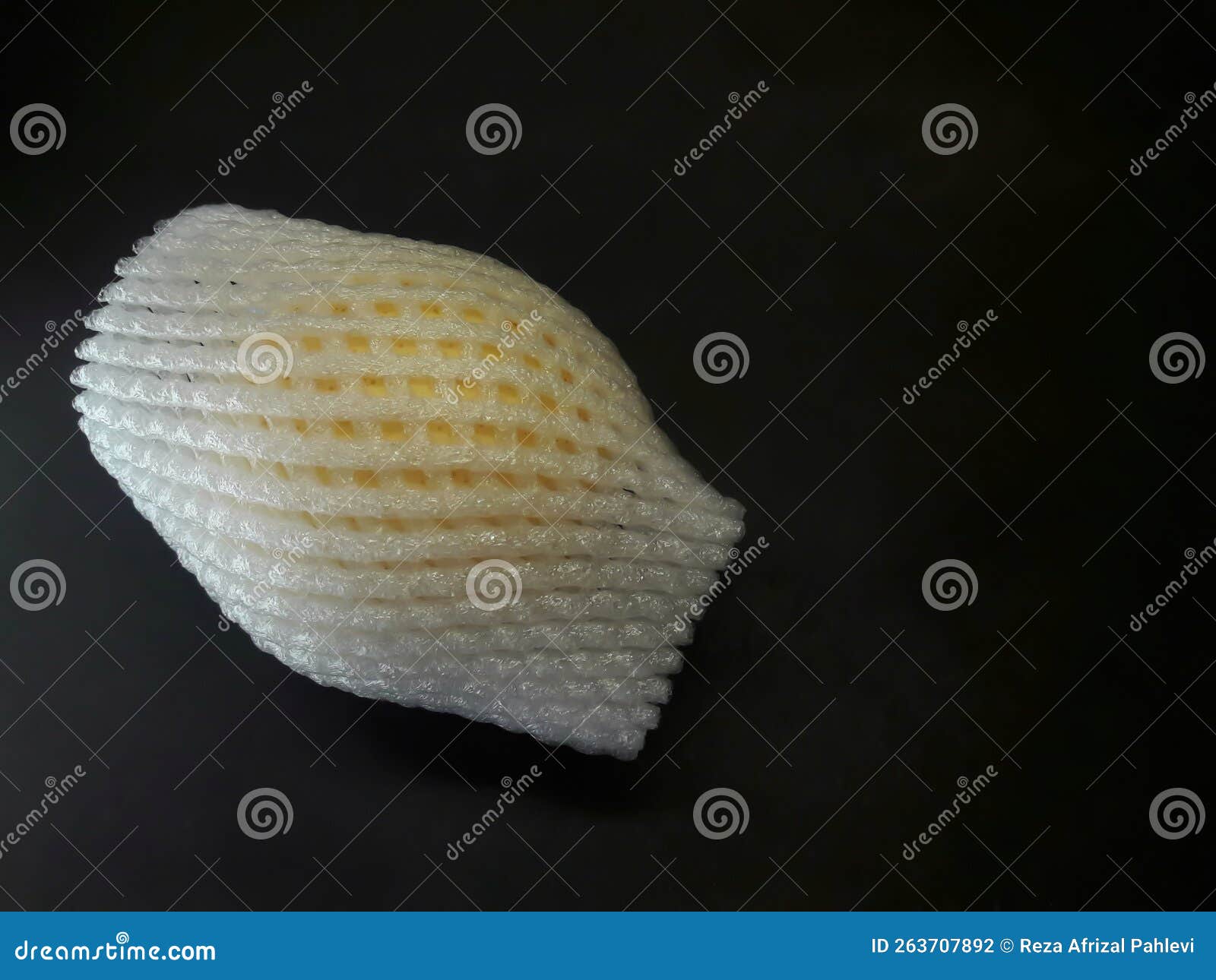 Pear Wrapped in Foam Net with Black Background Stock Photo - Image of ...