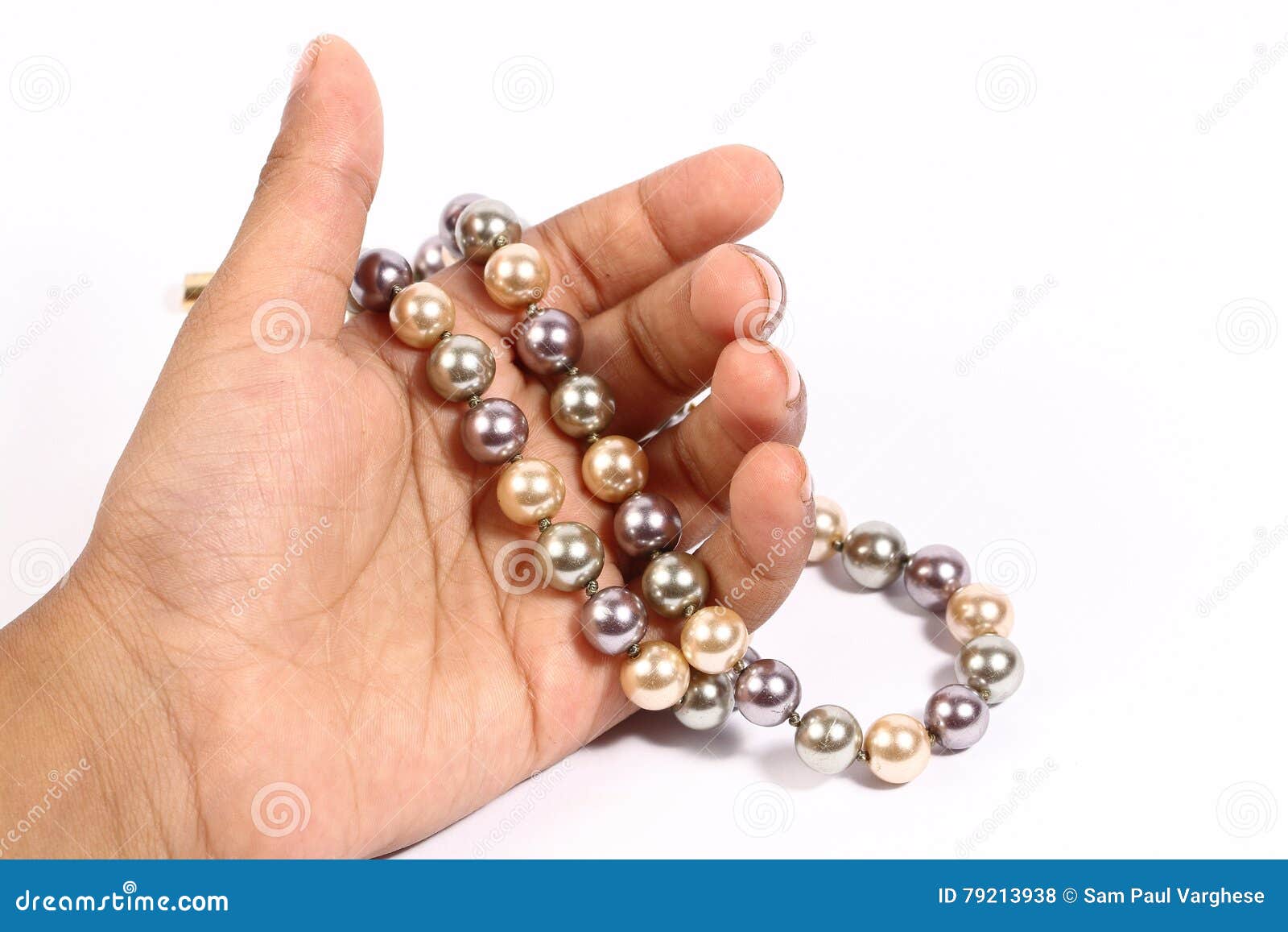 Pearl chain in the hand stock photo. Image of colorful - 79213938