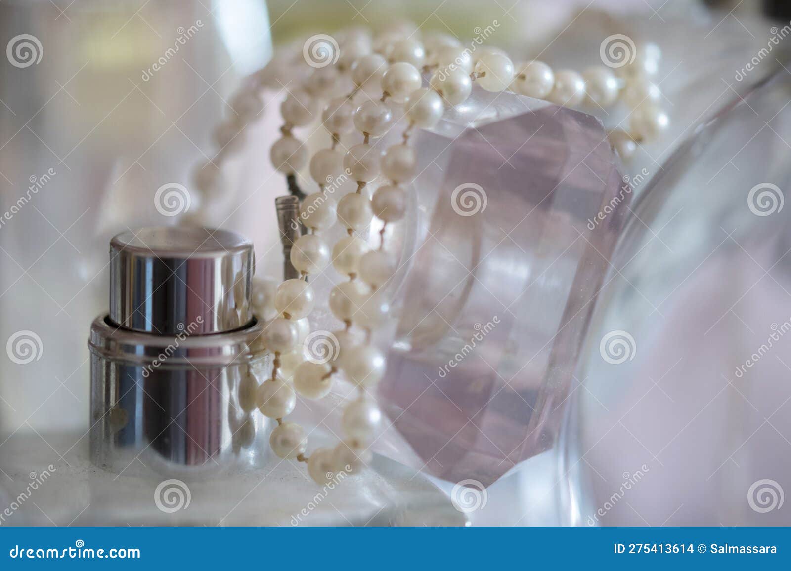 Pearl Necklace and Perfume Bottles Stock Photo - Image of elegant ...
