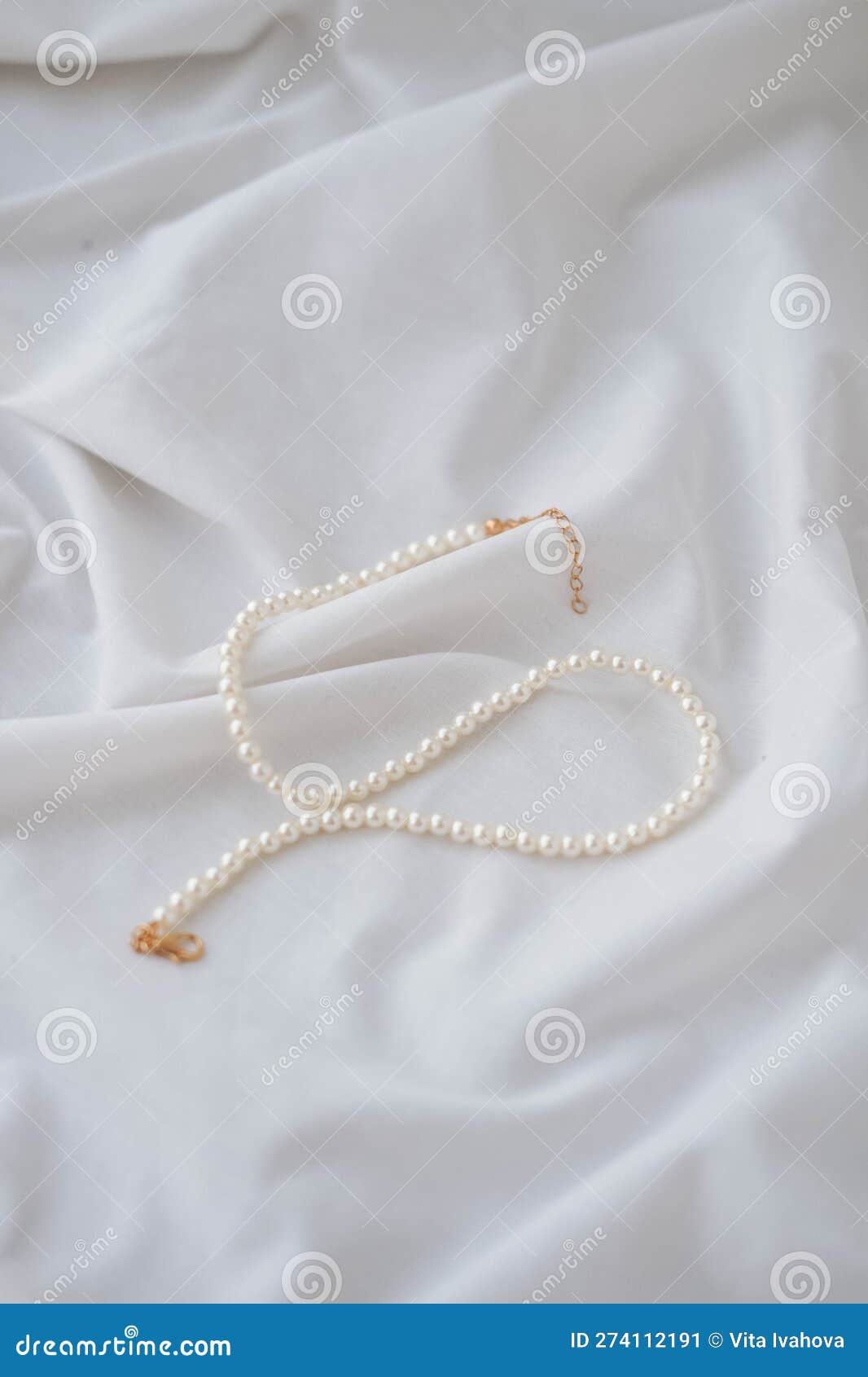 Pearl Necklace On White Satin Background Closeup Of Photo Stock Image
