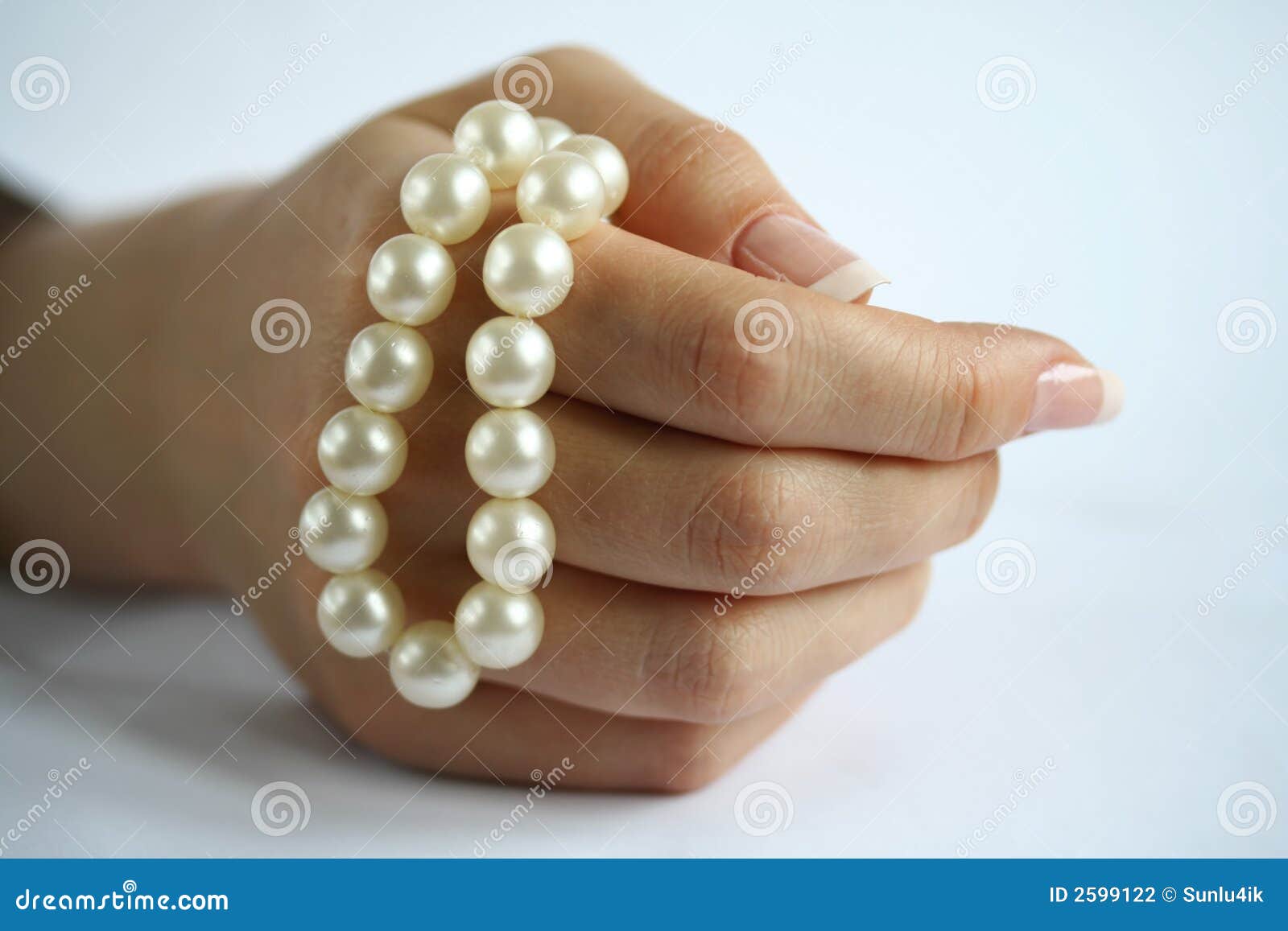 Pearl String in a Female Hand Stock Photo - Image of curve, close: 2599122