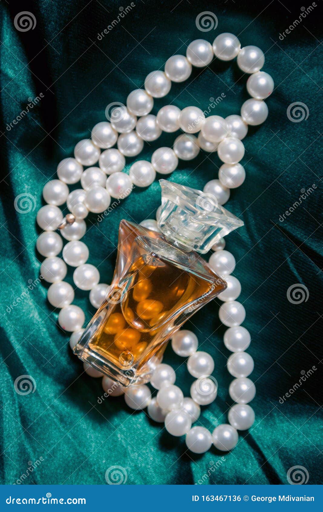 Pearls and perfume closeup stock photo. Image of fashion - 163467136