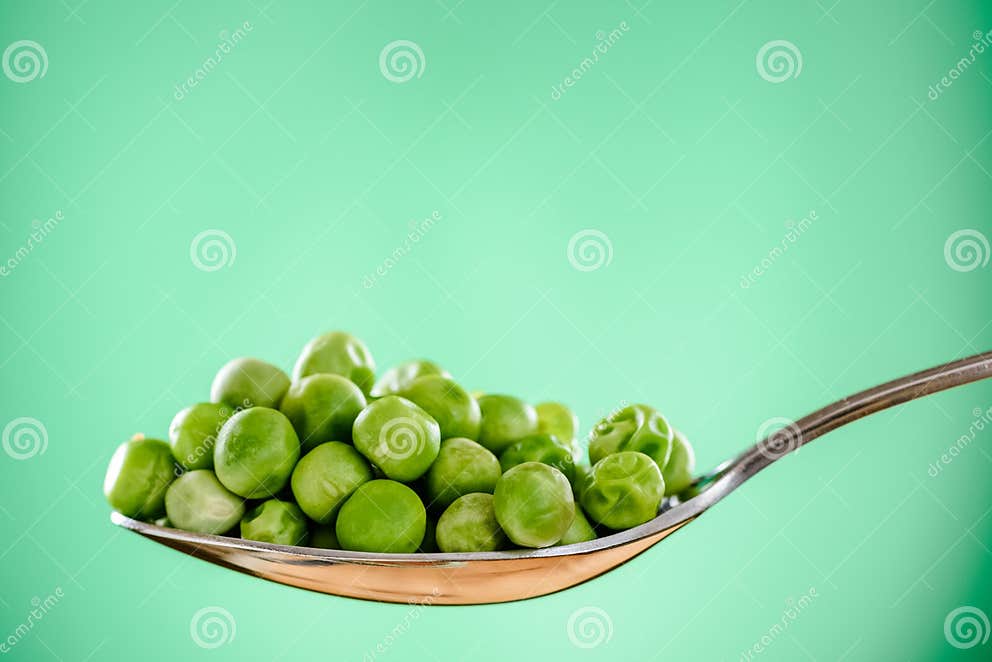 Peas on a spoon stock image. Image of single, healthy - 80911989