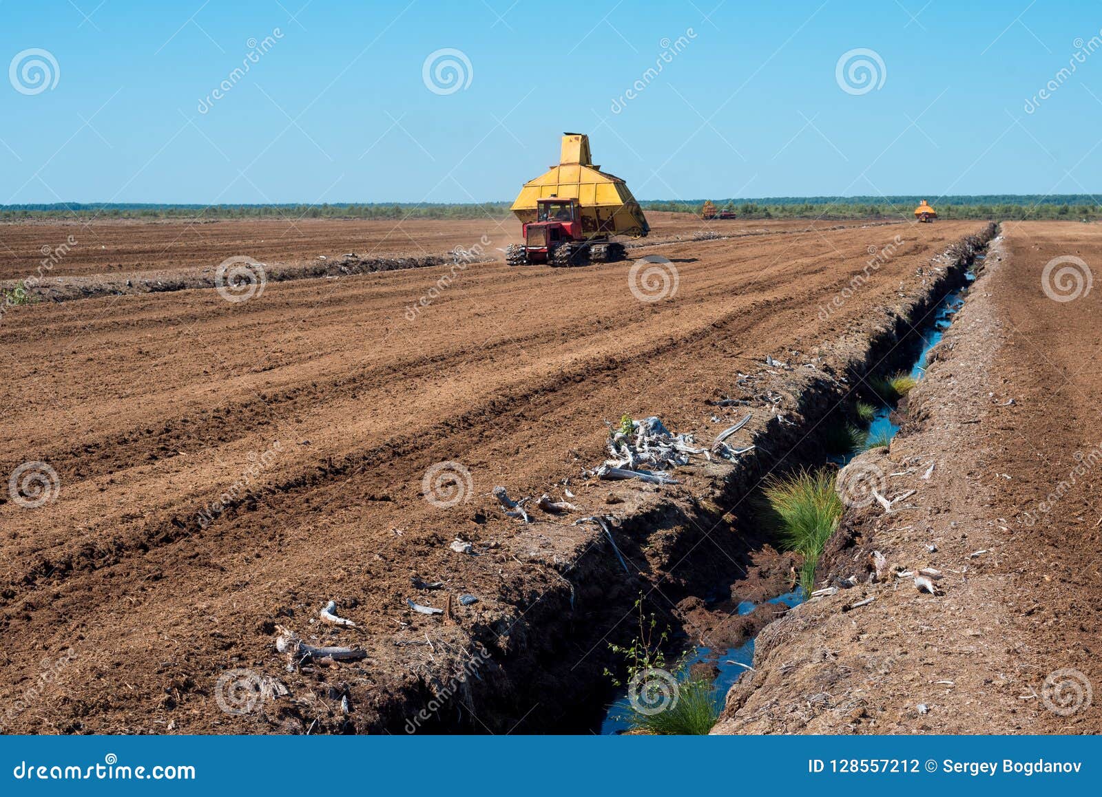 Peat extraction process stock photo. Image of landscape - 128557212