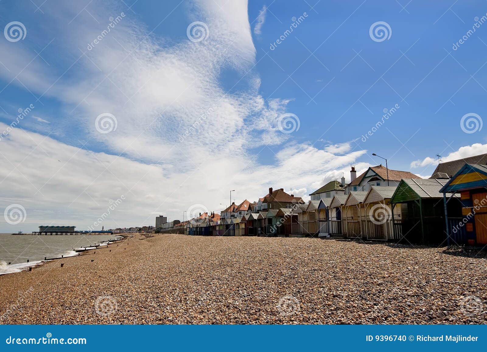 Pebble Beach with a Row of Small Huts Stock Photo - Image of pier ...
