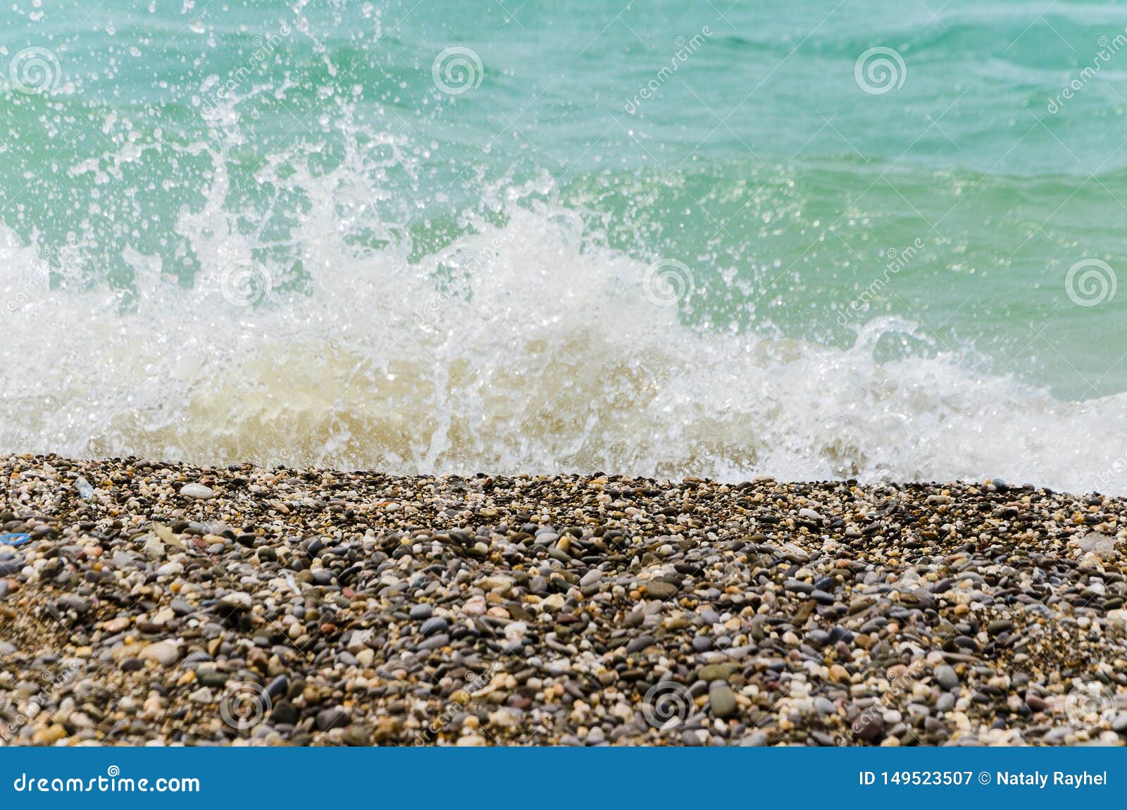 Pebble beach and sea waves stock image. Image of gravel - 149523507