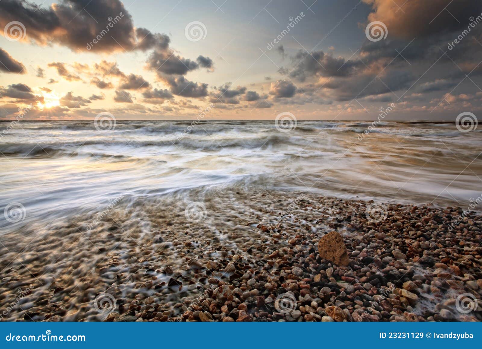 Pebble beach at sunset stock image. Image of landscape - 23231129