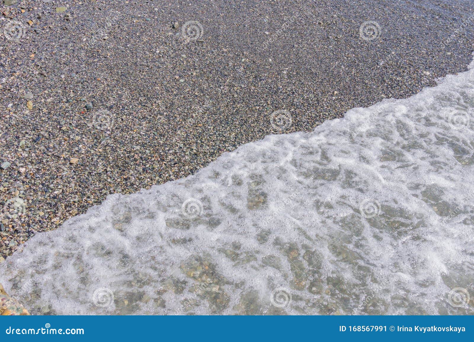 Pebble Coastline. Seashore with Transparent Water and Small Stones ...