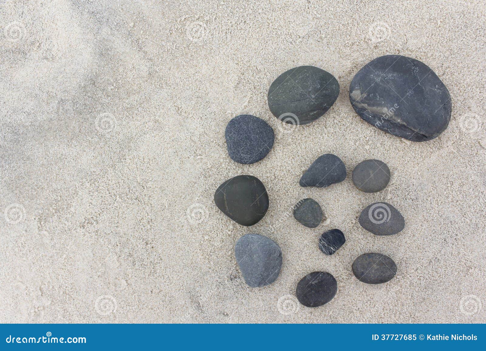 Pebble Design on Sand stock image. Image of creative - 37727685