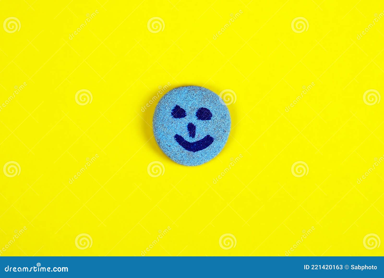 Pebble on the Paper stock image. Image of sign, face - 221420163