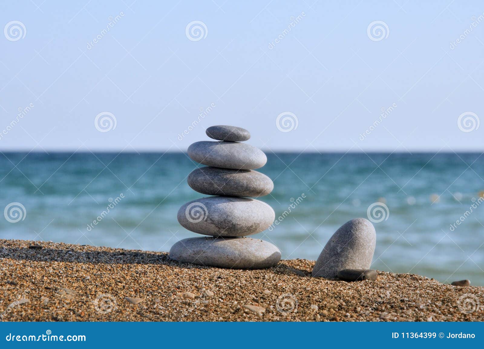 Pebble stack on the beach stock image. Image of round - 11364399
