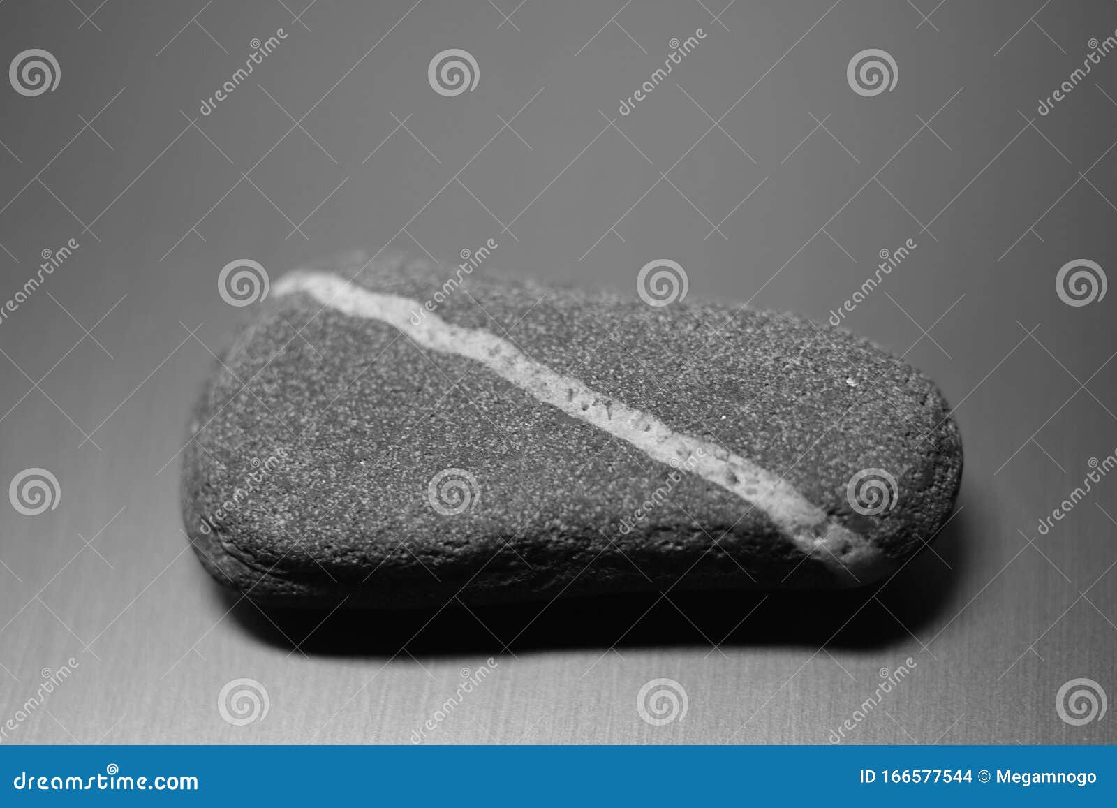 Pebble Stone with Natural Diagonal White Line on the Table, Bw Photo ...