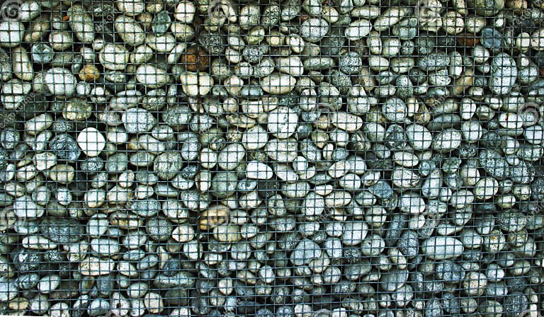 Pebble Stones in Iron Mesh Background Texture Stock Image - Image of ...