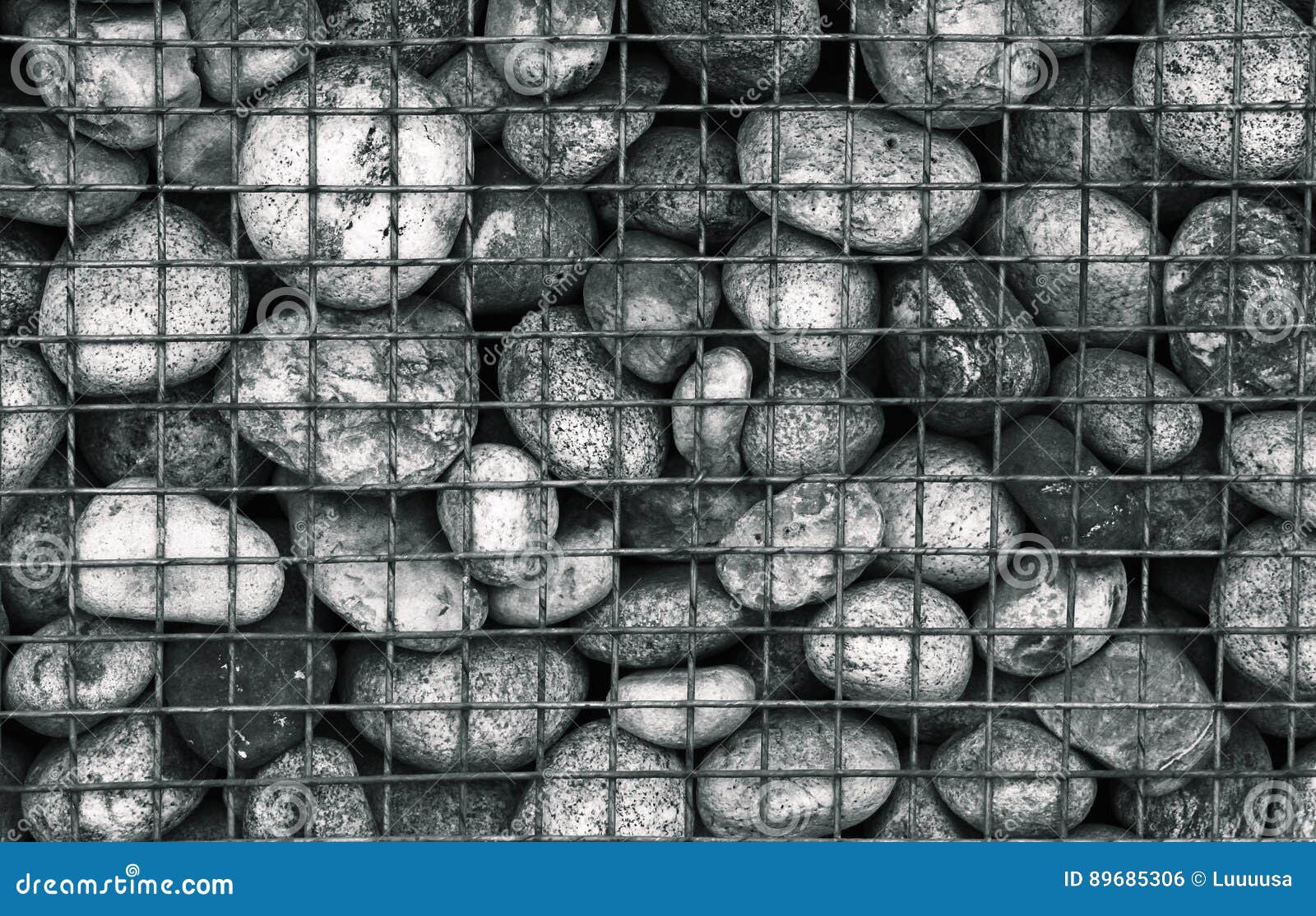 Pebble Stones in Iron Mesh Black and White Stock Photo - Image of metal ...