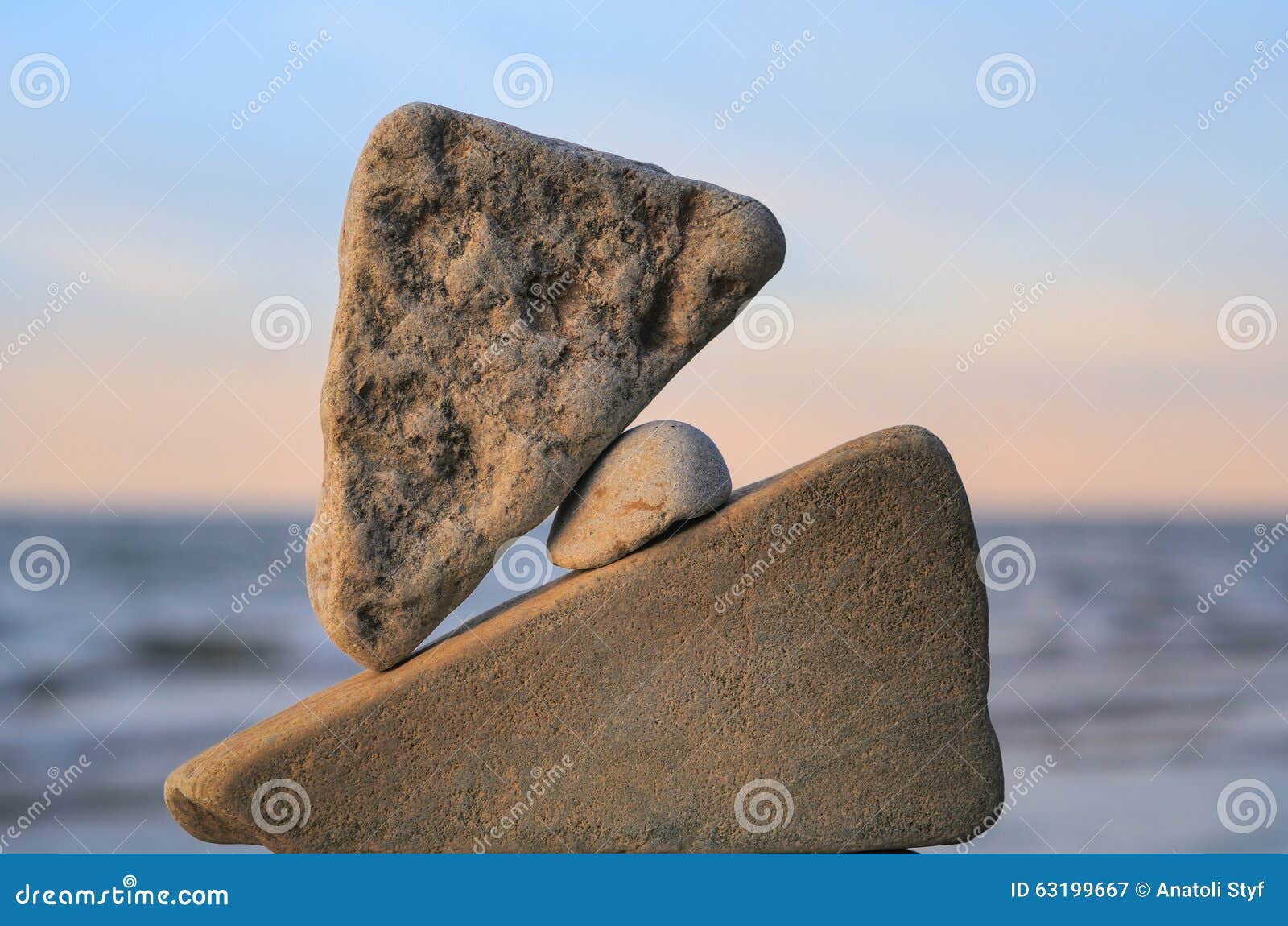 Pebble between two stones stock image. Image of accuracy - 63199667