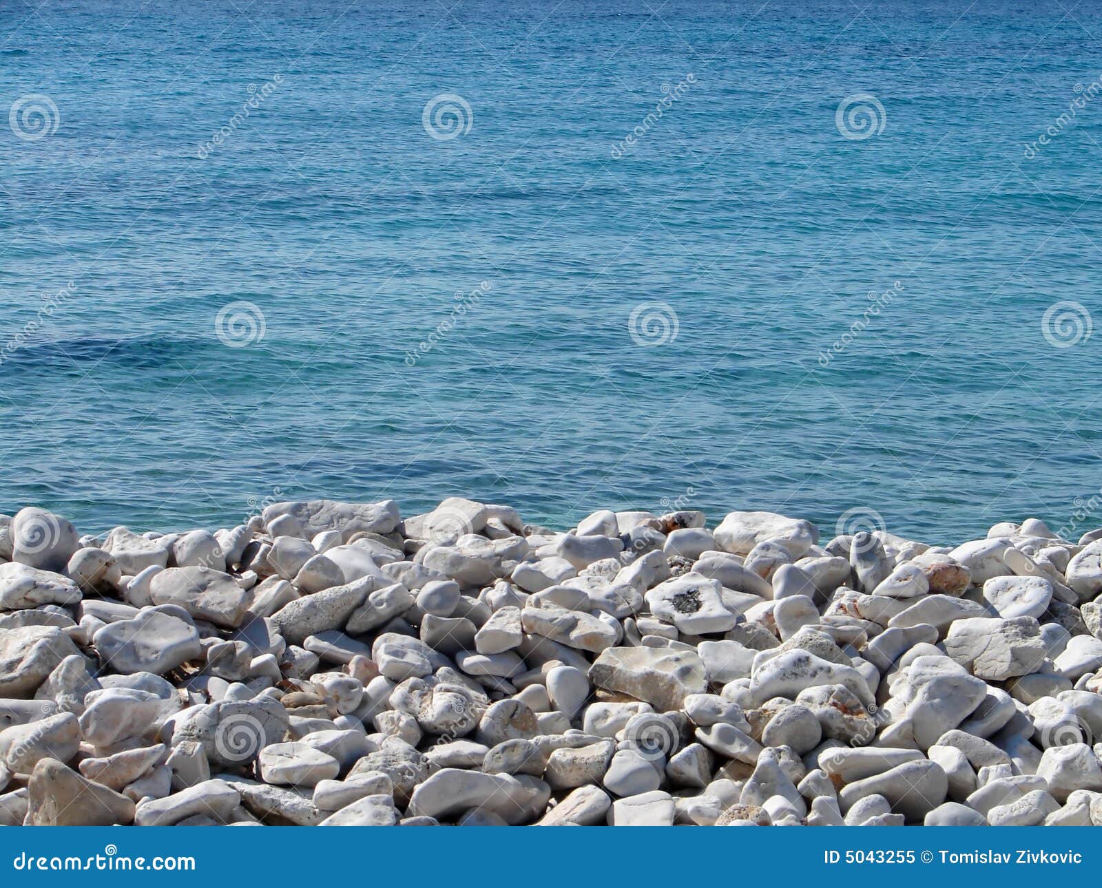 Pebbles on beach stock image. Image of gravel, pebbles - 5043255