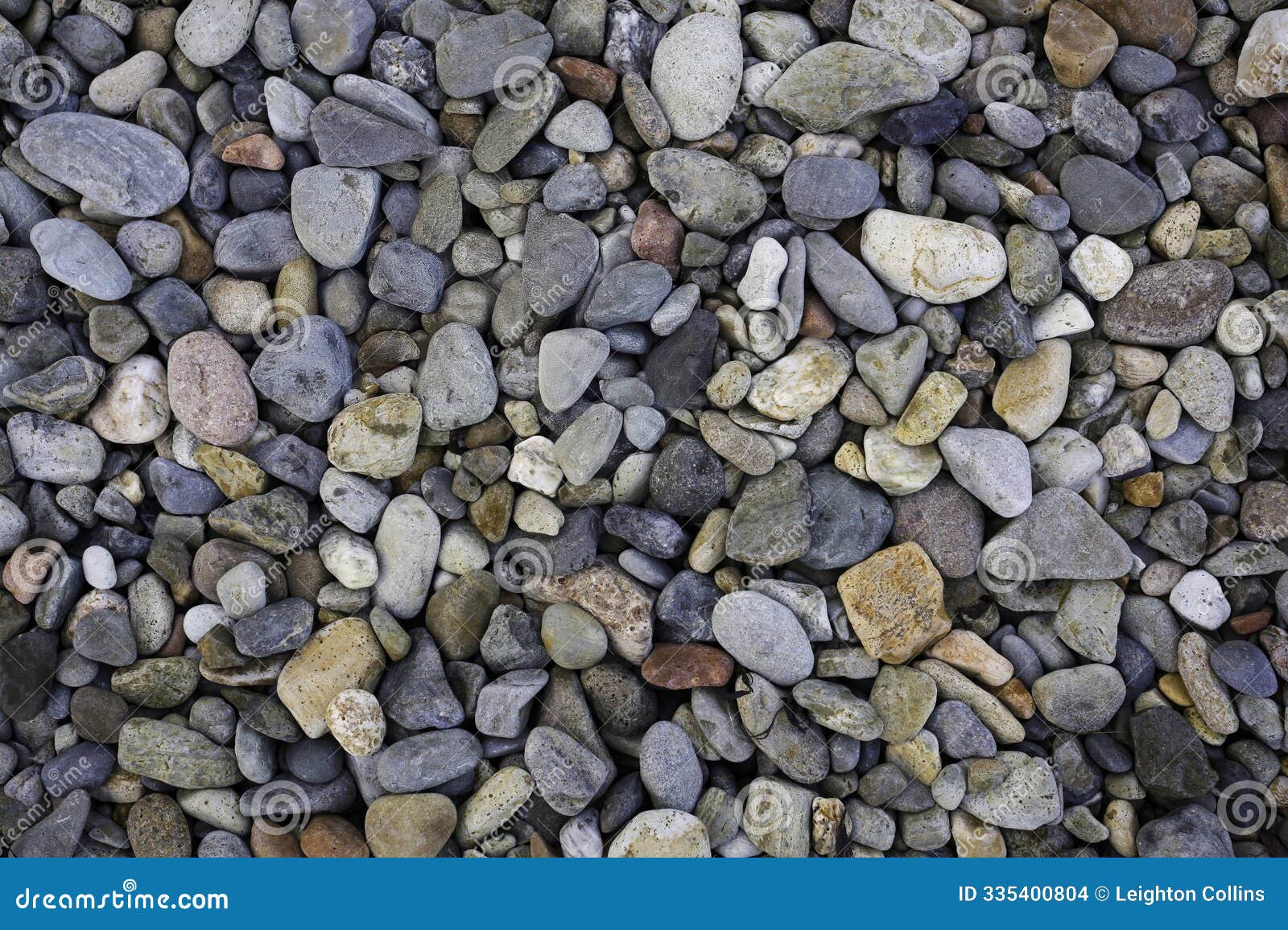 Pebbles on a beach stock photo. Image of colourful, yellow - 335400804