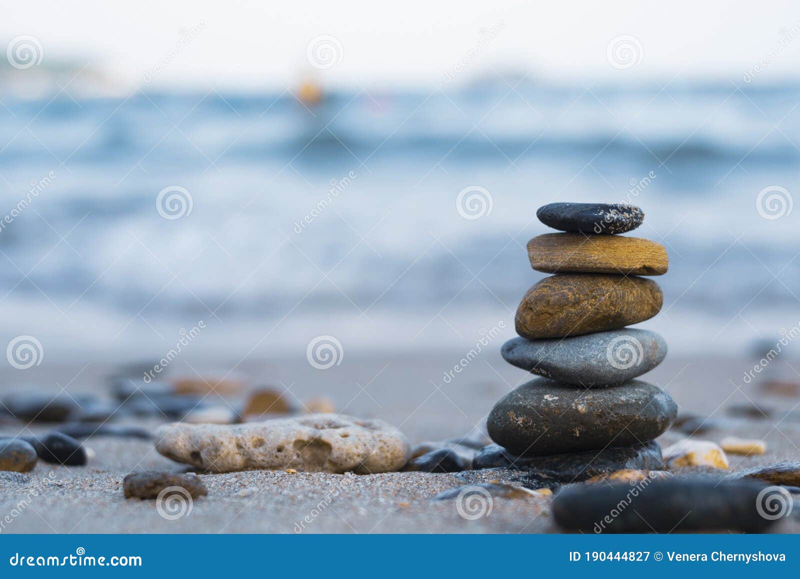 Pebbles are Piled on a Volcanic Rock by the Sea. Zen Concept Stock ...