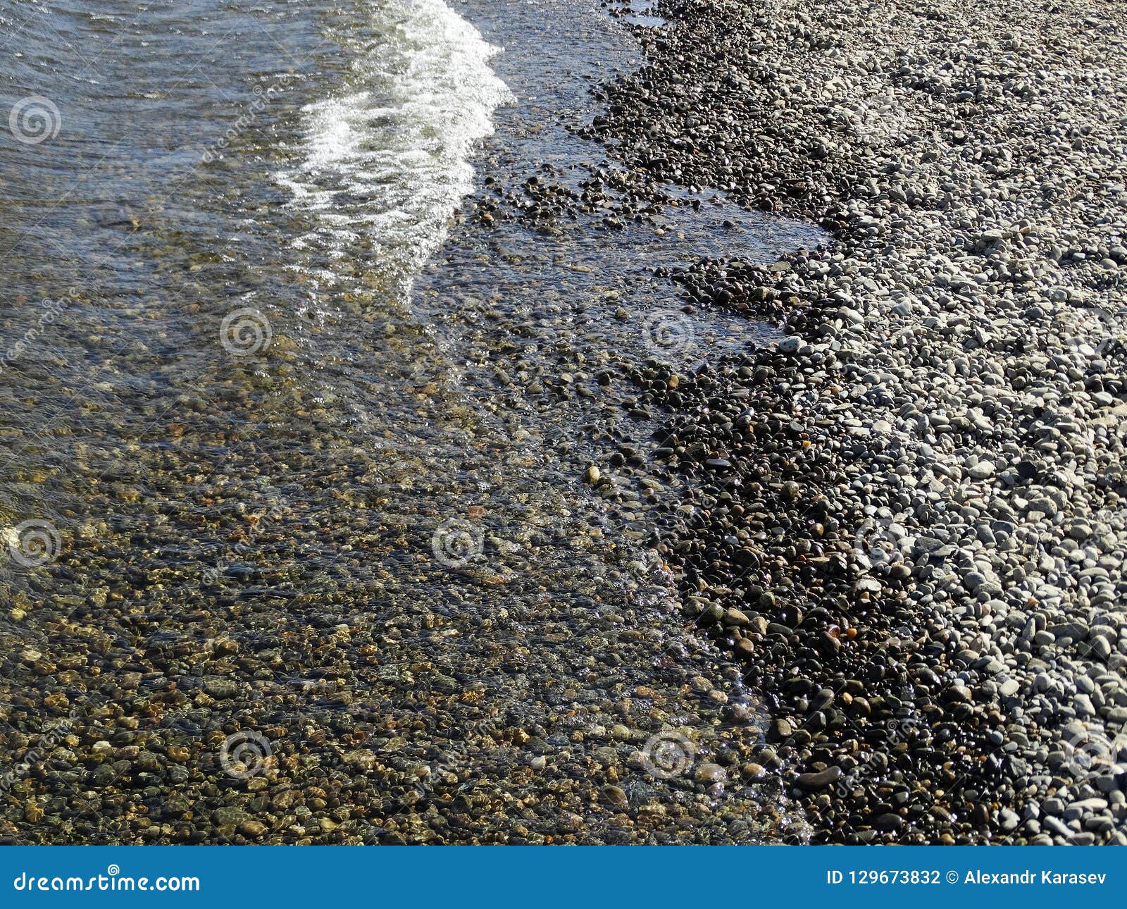 Pebbles on the river Bank stock photo. Image of small - 129673832