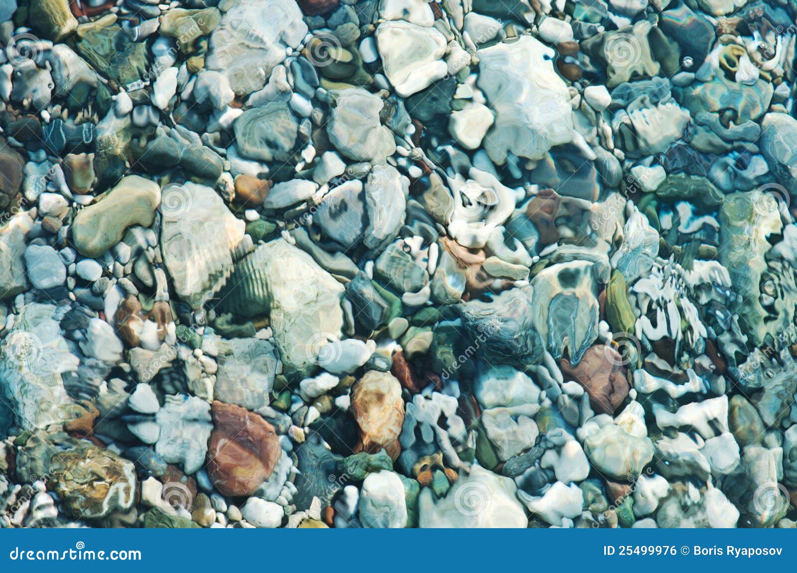 Pebbles on Sea Shore Over Water Stock Photo - Image of blue, smooth ...