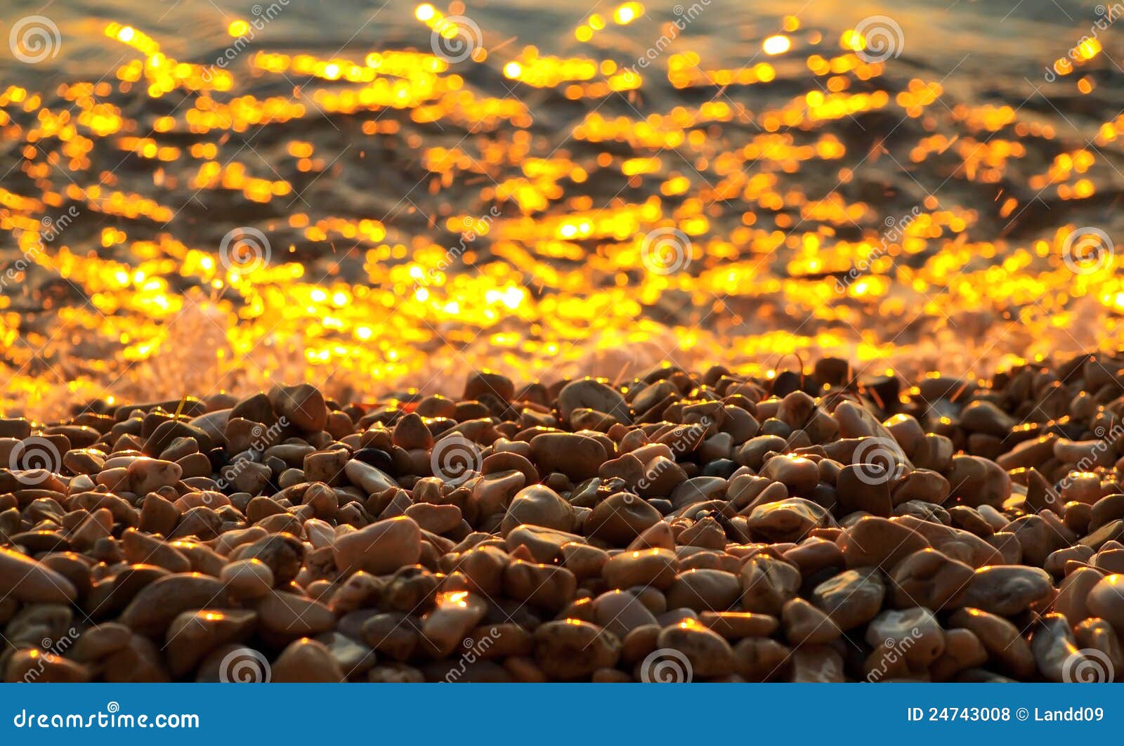 Pebbles and sea at sunset stock photo. Image of enjoy - 24743008