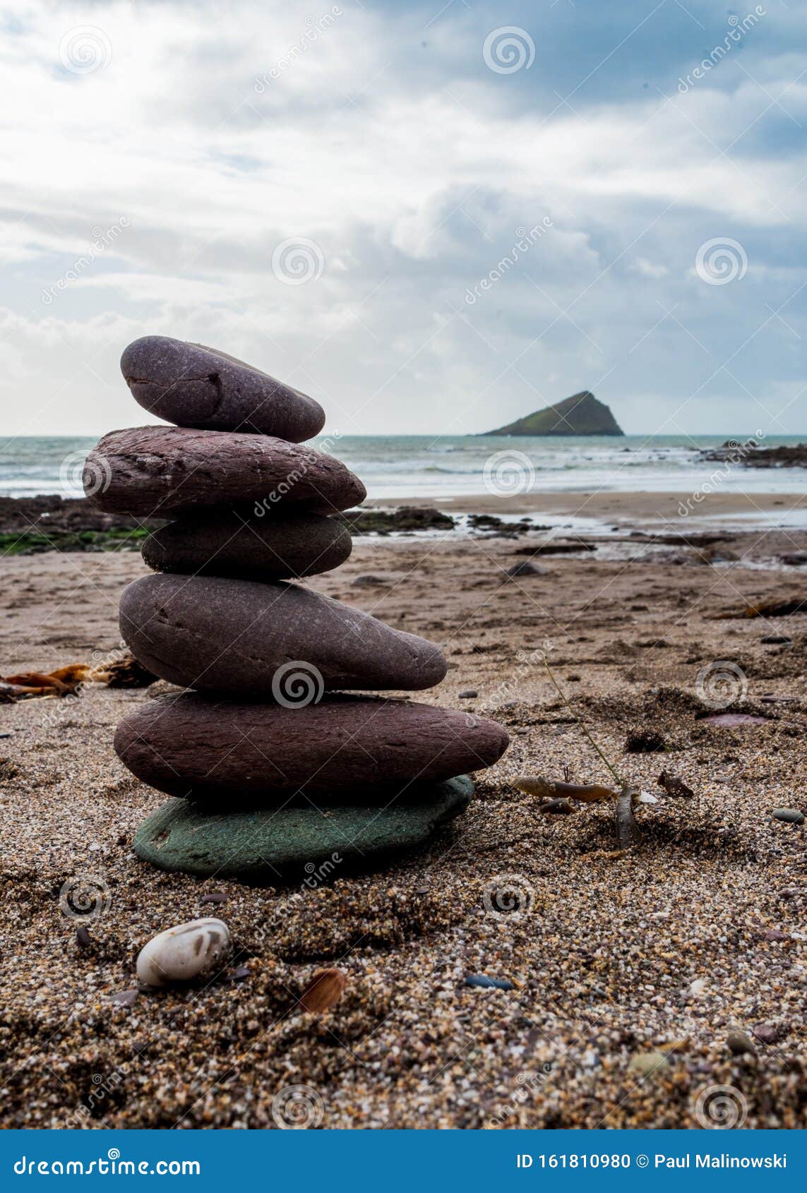 Pebbles in a Stack on the Beach Stock Photo - Image of ball, bench ...