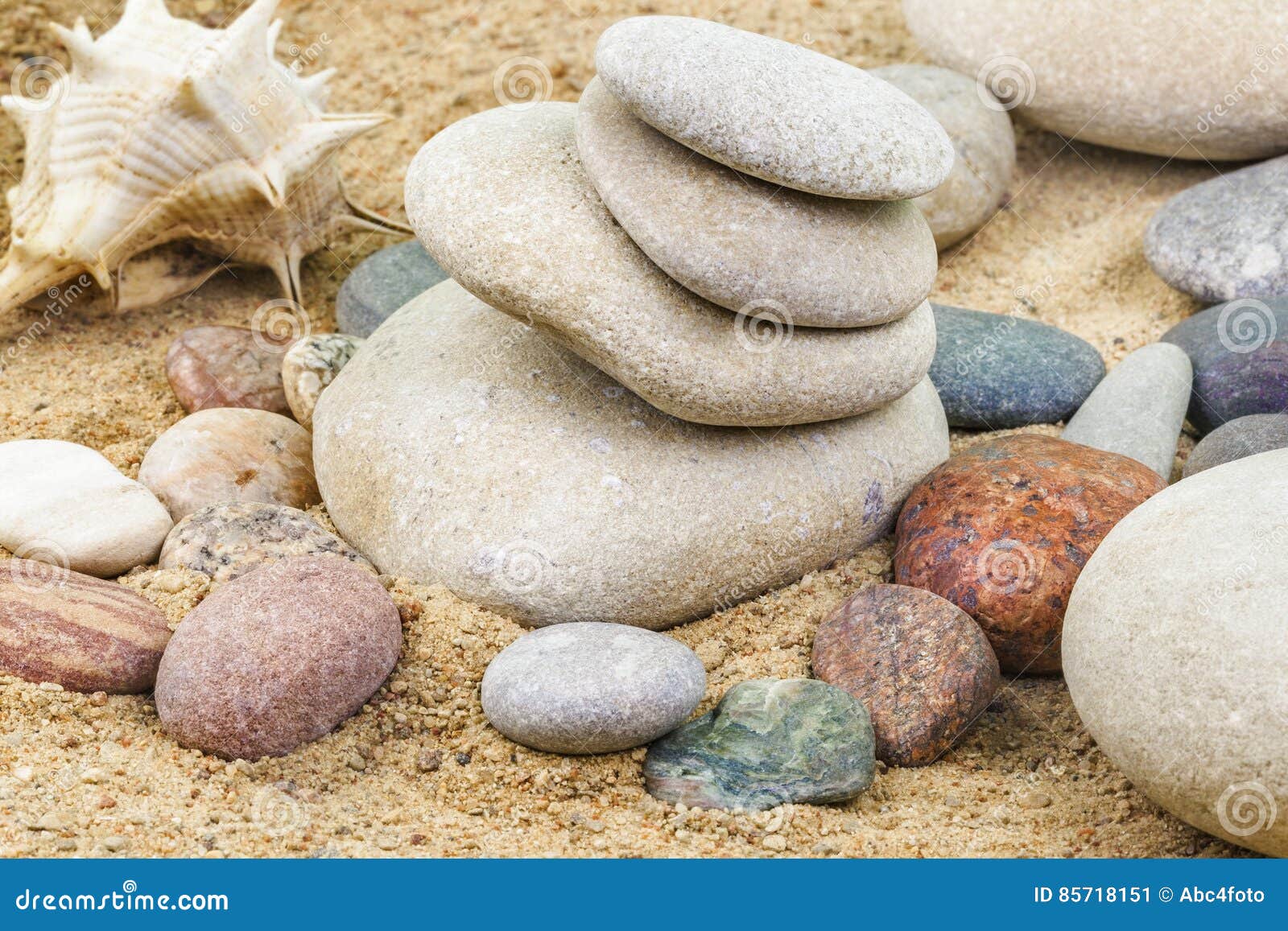 Pebbles stacked on sand stock image. Image of stacked - 85718151