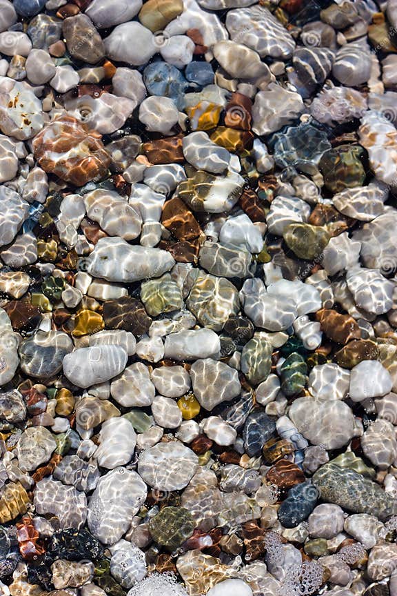 Pebbles and water stock photo. Image of closeup, ocean - 22381266