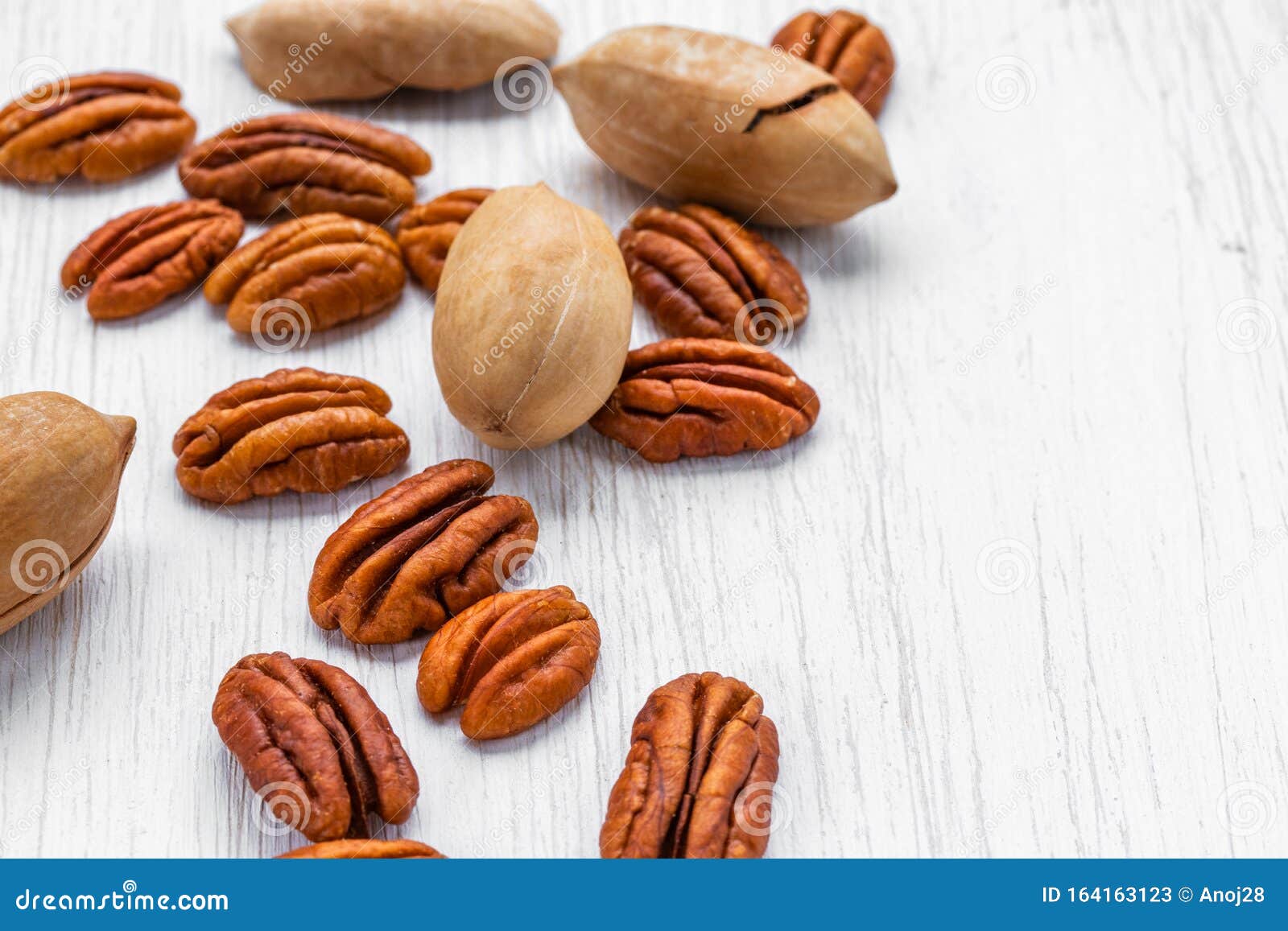 Pecans Peeled and in Shell Lying on a White Wooden Surface Stock Image ...