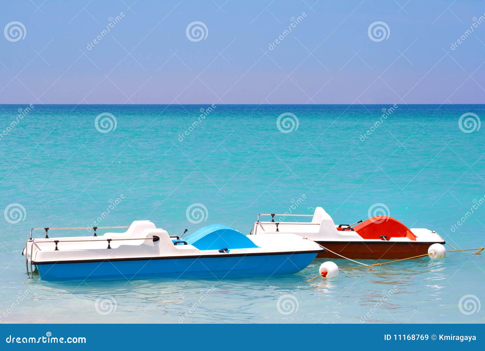 Pedal boats in the beach stock image. Image of relaxation - 11168769