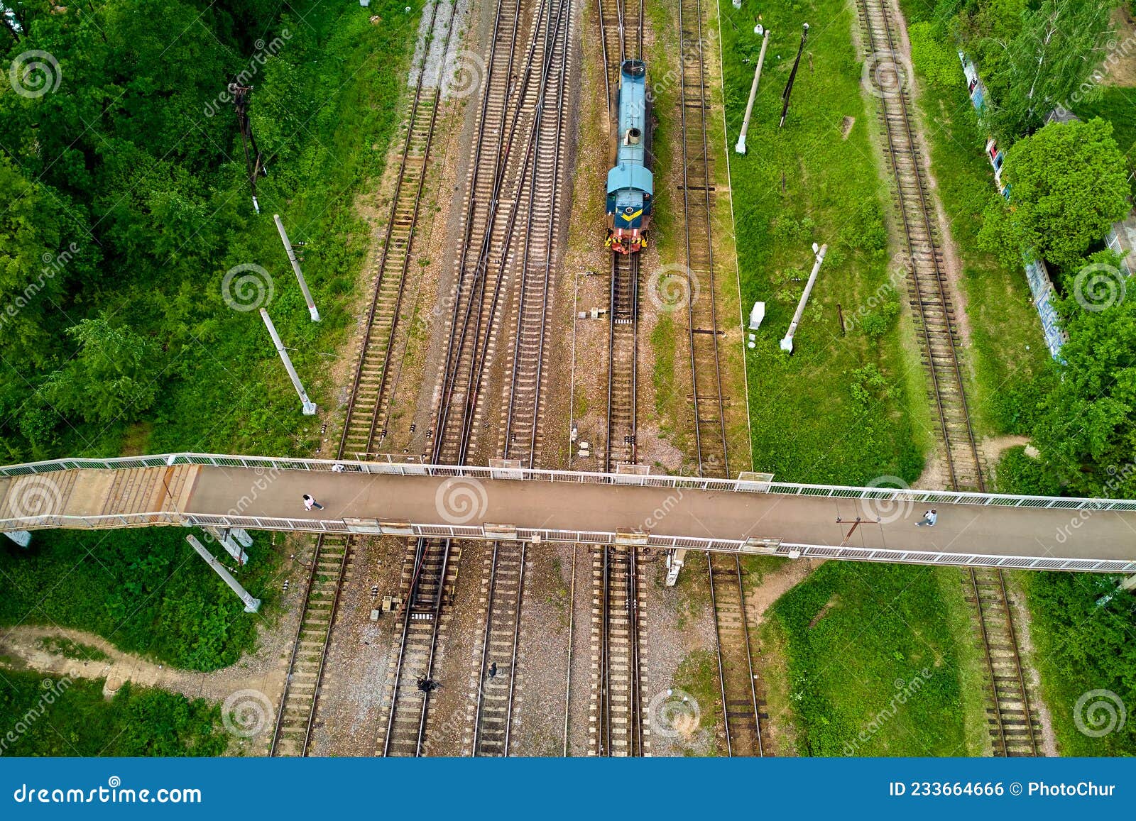 Pedestrian Bridge Over the Railroad Tracks and Trolley Stock Photo ...