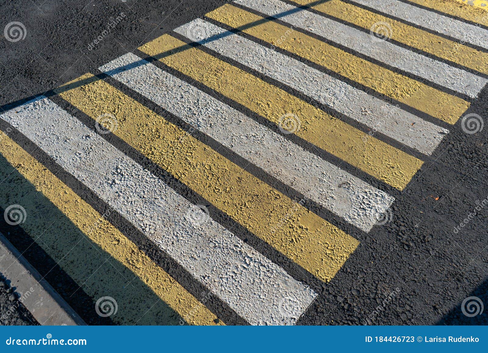 Pedestrian Crosswalk with Yellow and White Lines on the Asphalt Stock ...