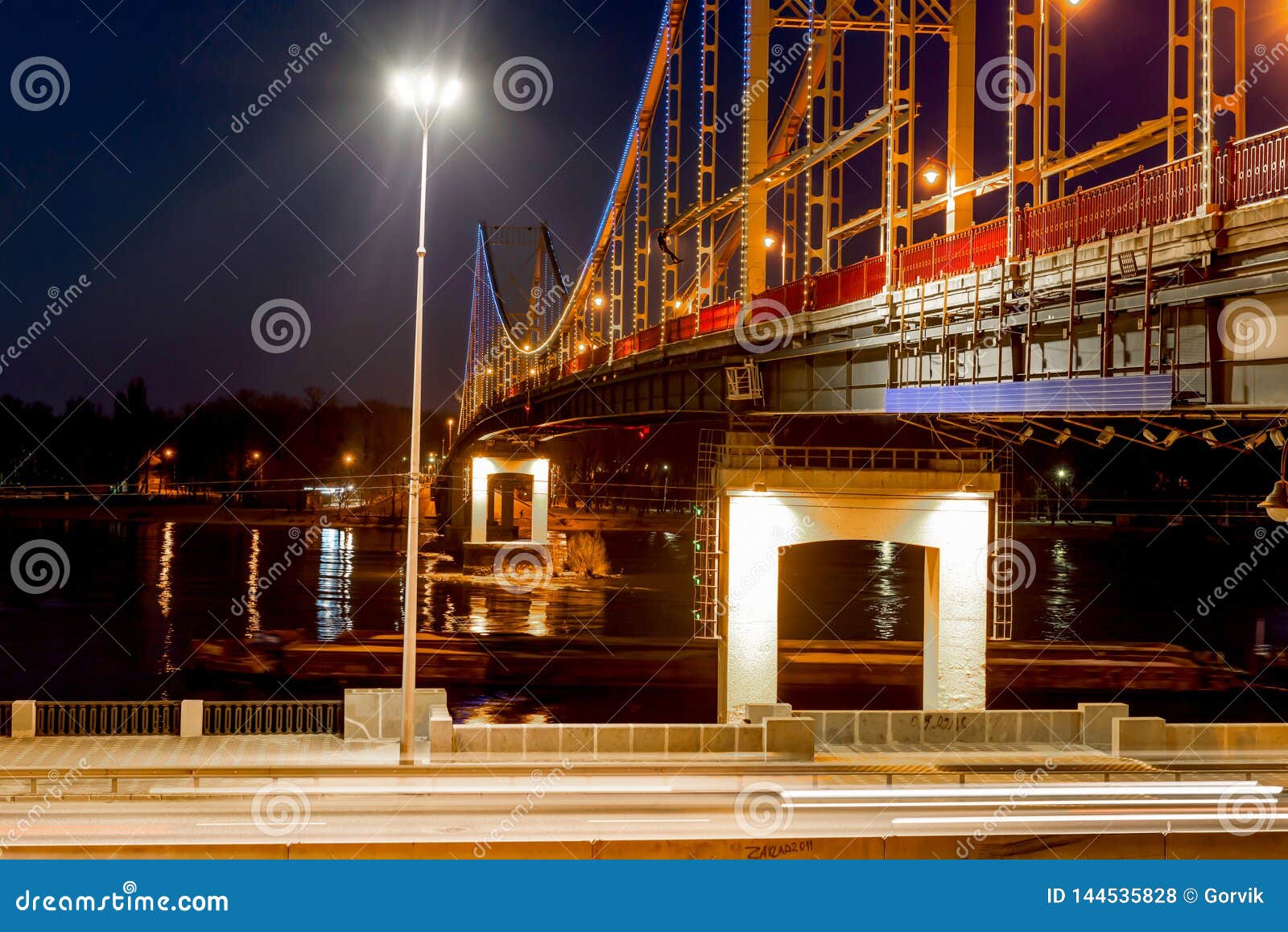 Pedestrian Metal Bridge with Colored Lights Across the River Stock ...