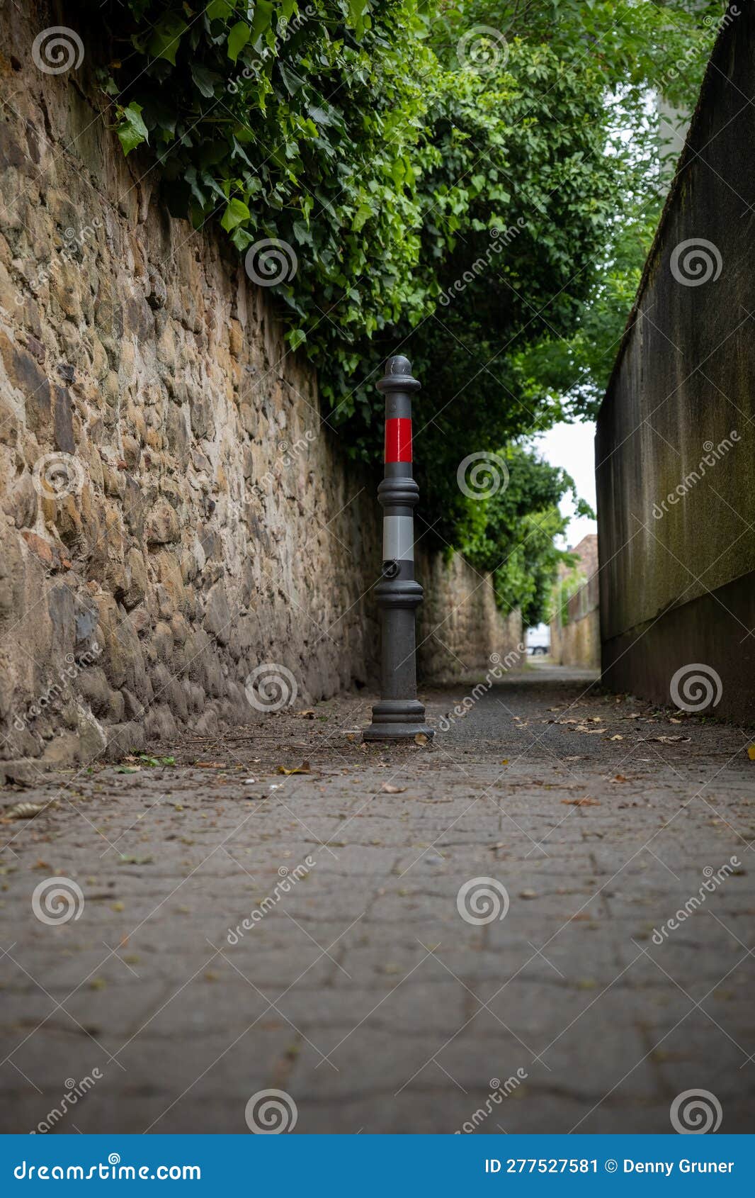 A Pedestrian Path with a Barrier Post Stock Image - Image of trip ...