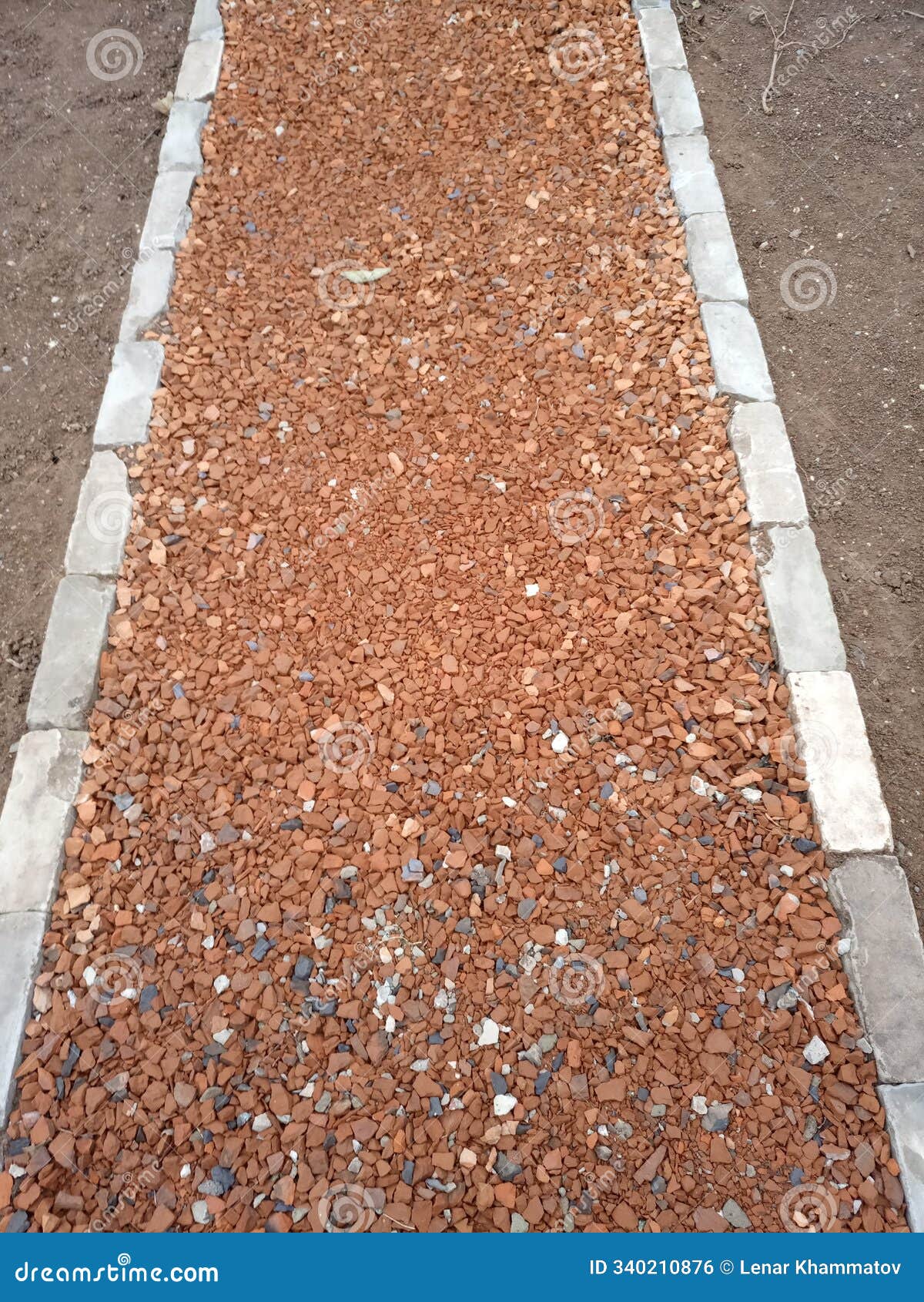 The Pedestrian Path is Lined with White Bricks and Covered with Small Red Brick Chips. Stock ...