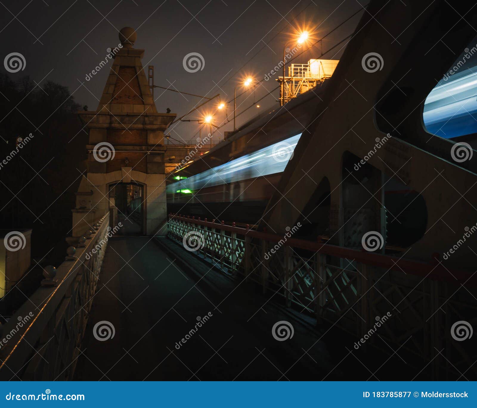 Pedestrian Railway Bridge and Lights of a Passing Train Stock Image ...