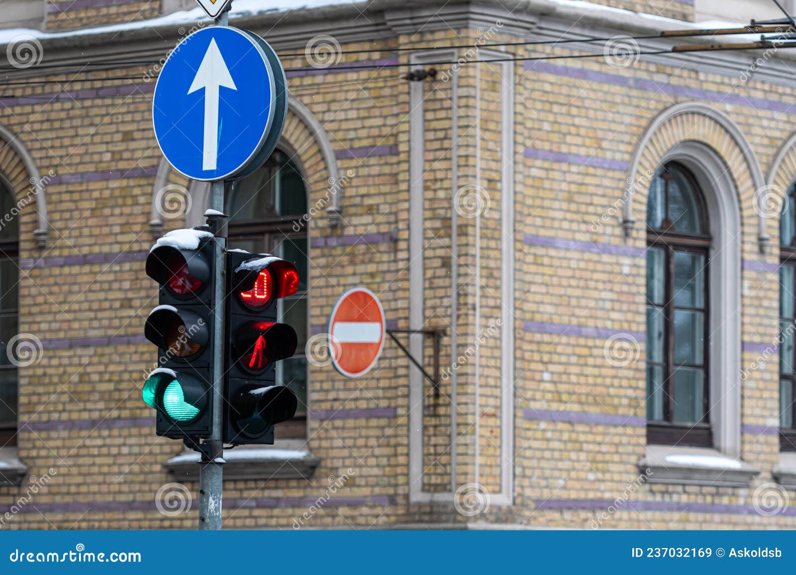 Pedestrian Traffic Light with a Timer on the Background of the Building ...