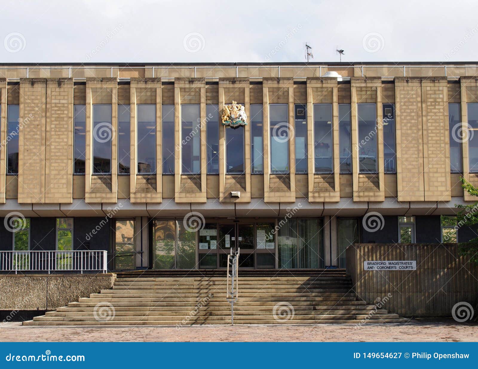 Pedestrians Walk Past The Front Of Bradford Magistrates Court In West