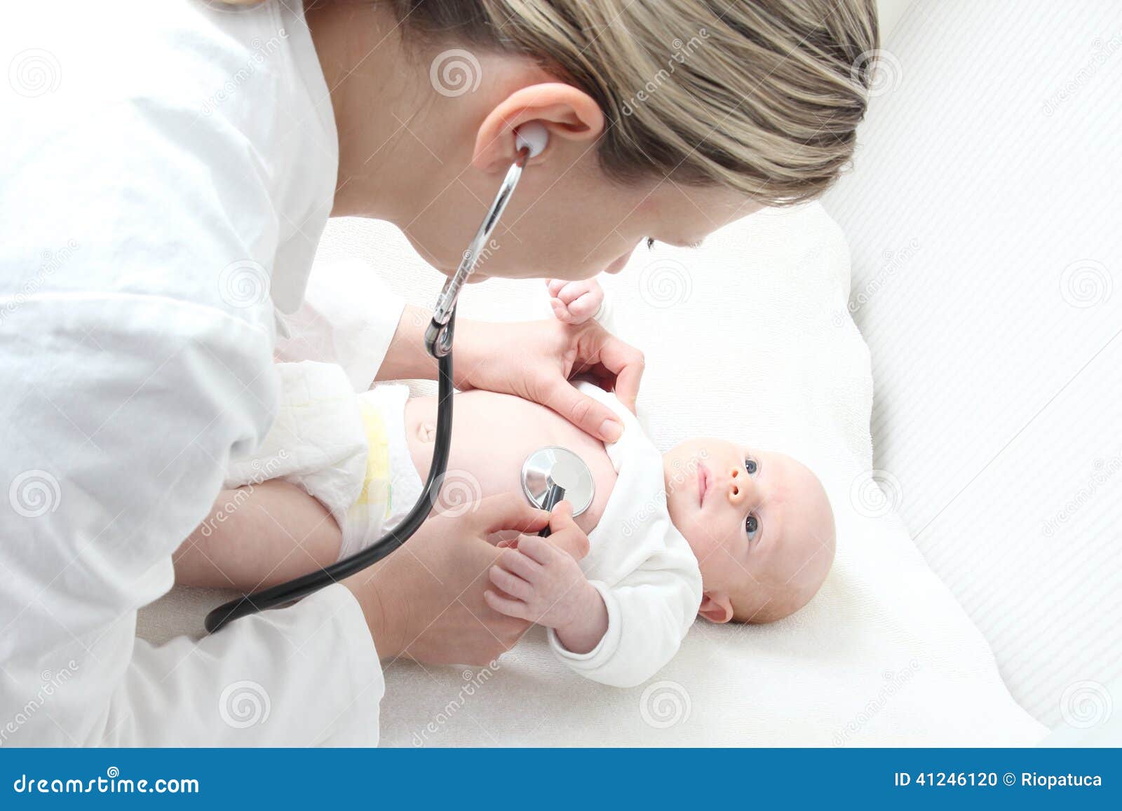 Pediatrician with Baby Checking Possible Heart Defect Stock Photo ...