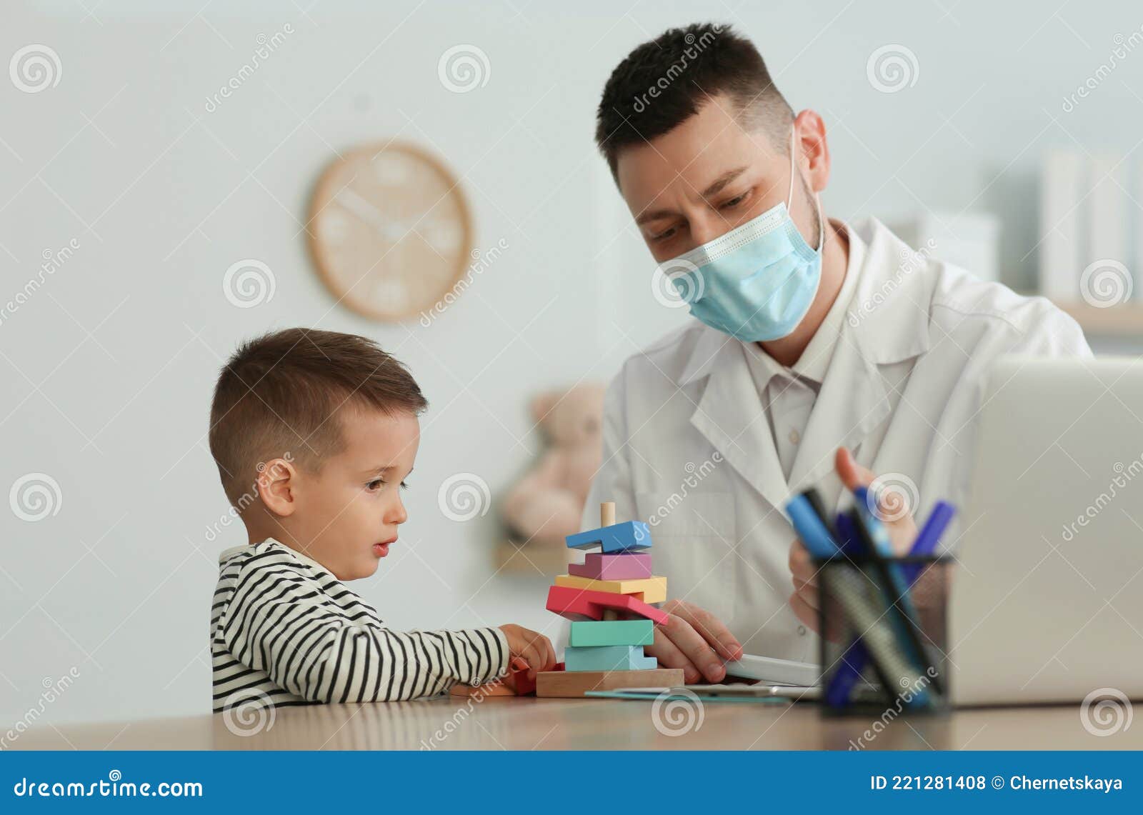 Pediatrician Playing with Boy at Hospital Stock Photo - Image of ...